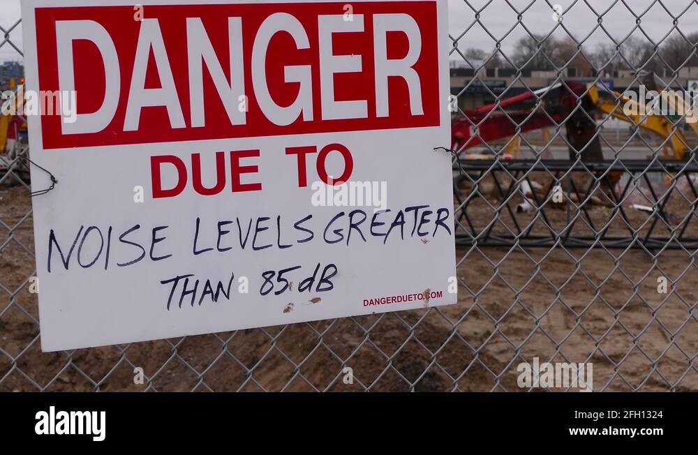 Loud noise warning signs at construction site Stock Video Footage - Alamy