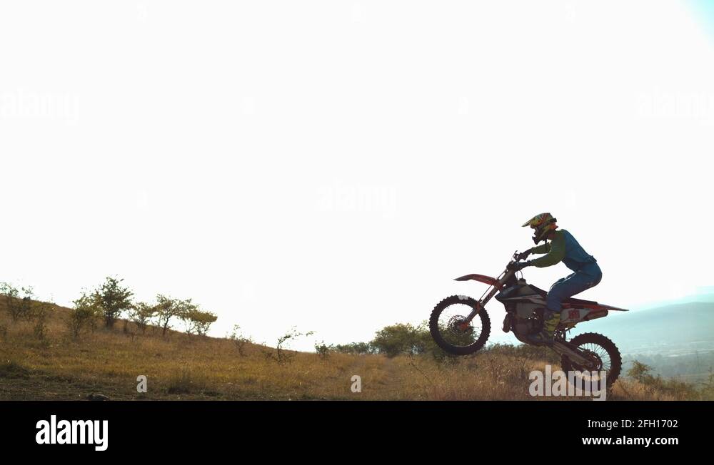 Motocross rider jumping with his motorcycle Stock Video Footage - Alamy