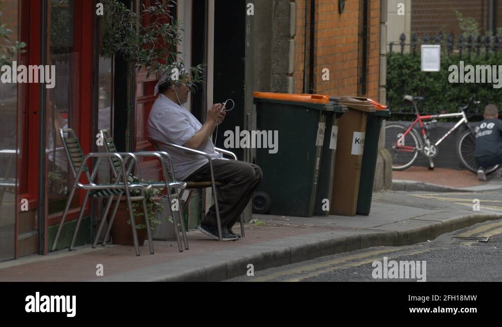 Man sitting street Stock Videos & Footage - HD and 4K Video Clips - Alamy