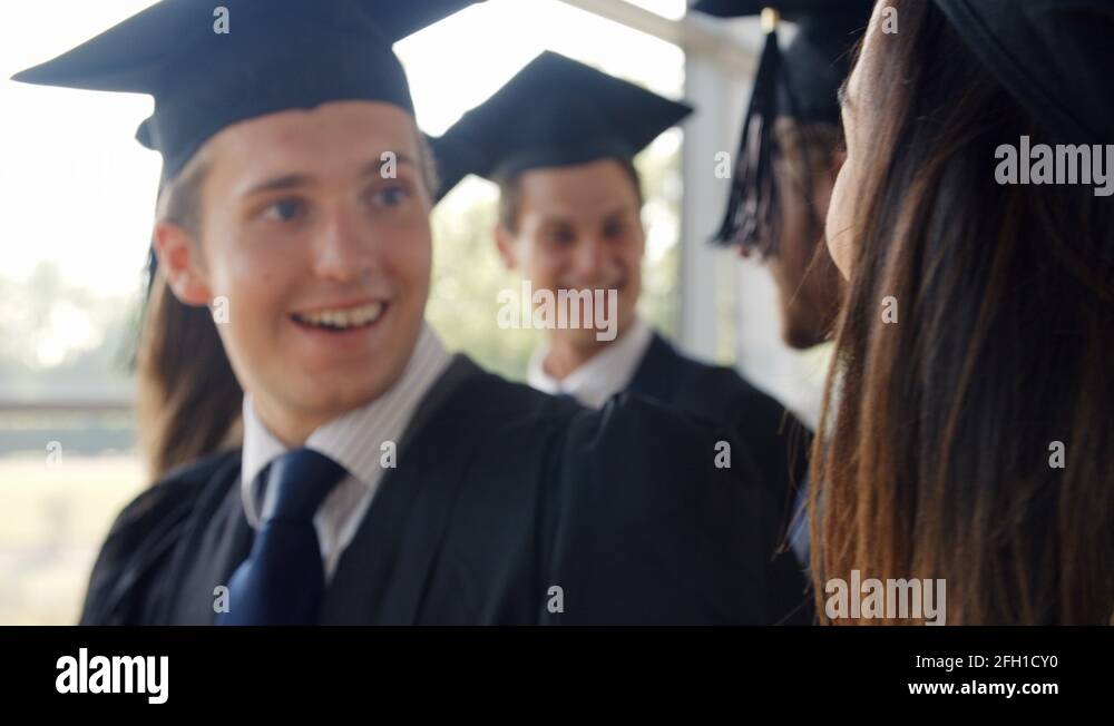 Students At Graduation Ceremony Throwing Hats In The Air Stock Video ...