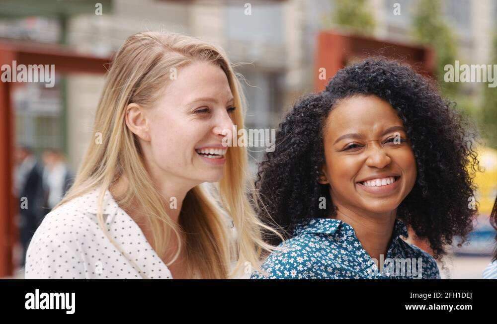 Female Colleagues Smiling To Camera Outside Their Workplace Stock Video