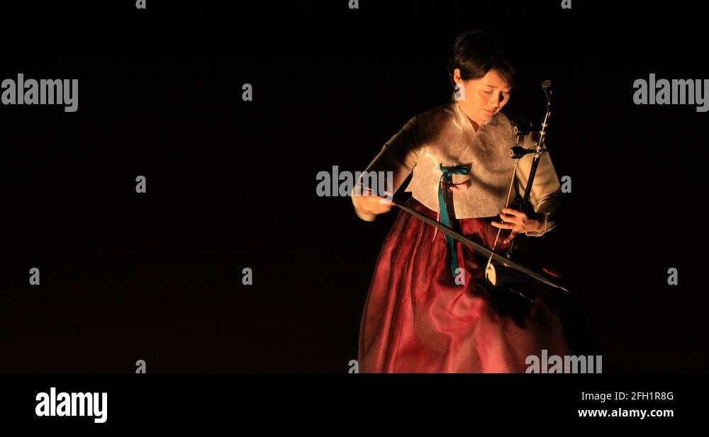 Korean female musician playing the Haegeum, Korean traditional string ...