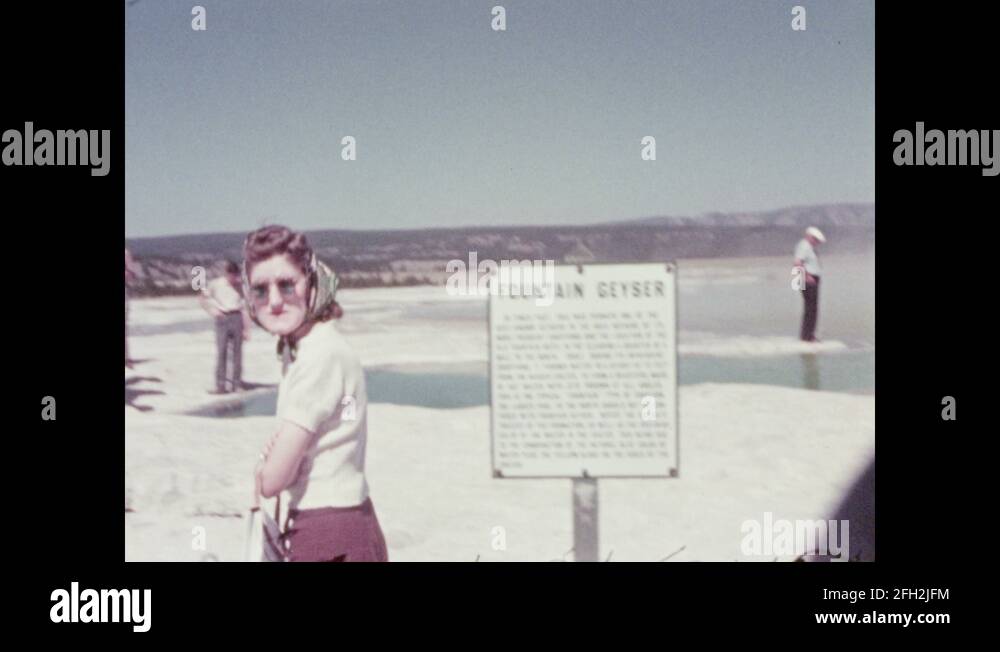 1950s: UNITED STATES: Fountain geyser sign. Man stands by pool. Water ...
