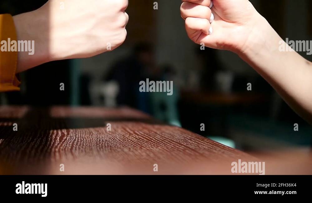 Rock paper scissors hand game. Two hands top aerial view. Tiled floor ...