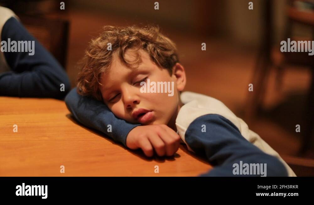Kid asleep at table Stock Videos & Footage - HD and 4K Video Clips - Alamy