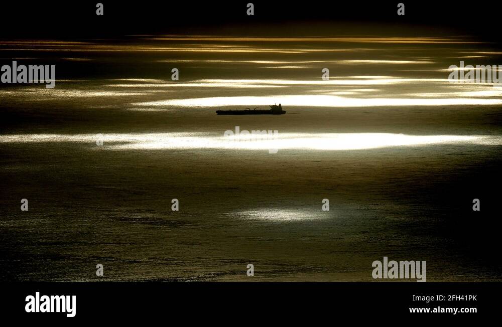 Container ship on big moon lit ocean Stock Video Footage - Alamy
