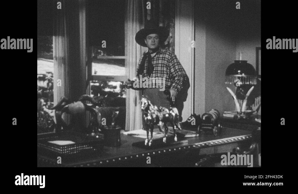1950s: Bob Hope in cowboy hat and cowboy wear speaks on the phone from ...