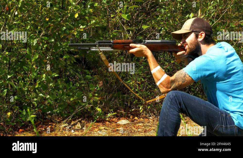 Man shooting rifle Stock Videos & Footage - HD and 4K Video Clips - Alamy