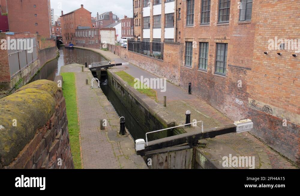 Canal Lock And Barge On Part Of The Birmingham Canal Network Stock Video Footage Alamy