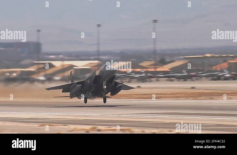 McDonnell Douglas F-15E Strike Eagle aircraft takes off and flies in ...