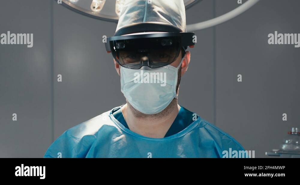 Portrait of surgeon using augmented reality hololens headset during ...