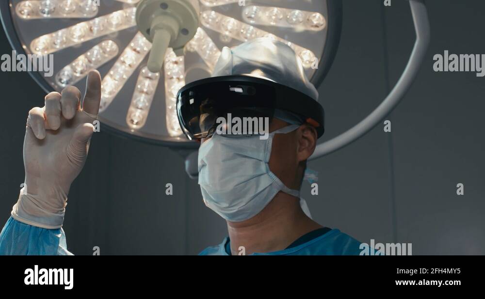 Portrait of surgeon using augmented reality hololens headset during ...