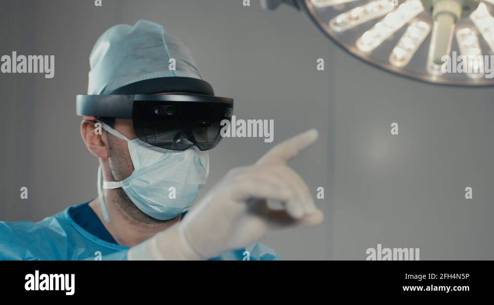 Portrait of surgeon using augmented reality hololens headset during ...
