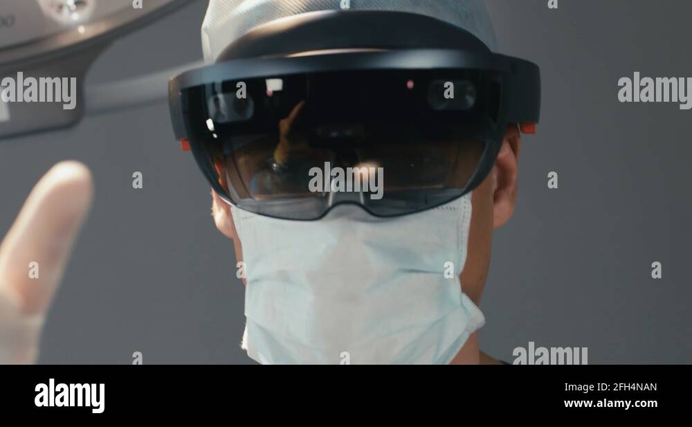 Portrait of surgeon using augmented reality hololens headset during ...