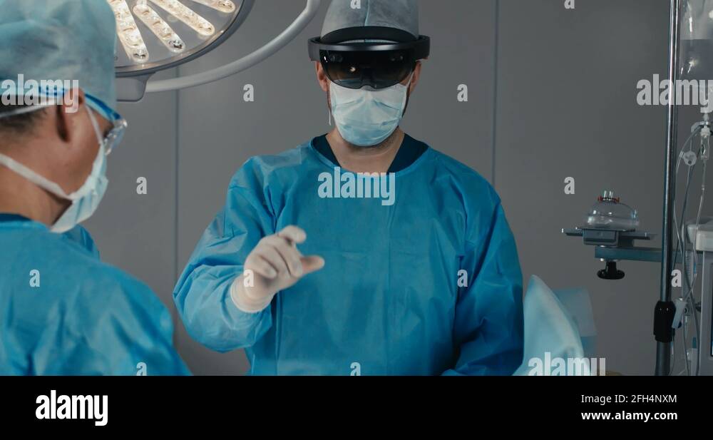 Team of surgeons using augmented reality hololens headset during ...