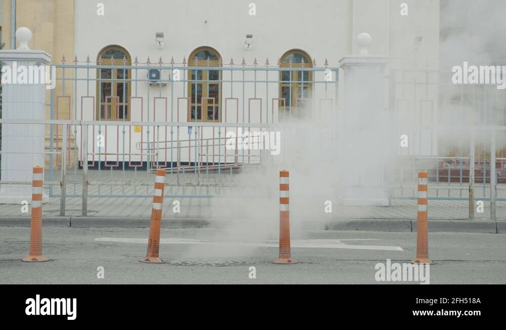 Steam from a broken sewer utility line at winter city Stock Video ...