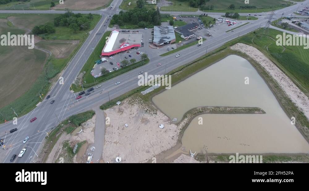Triangle Shaped Mini Plaza With Hardware Store And Gas Station Aerial ...