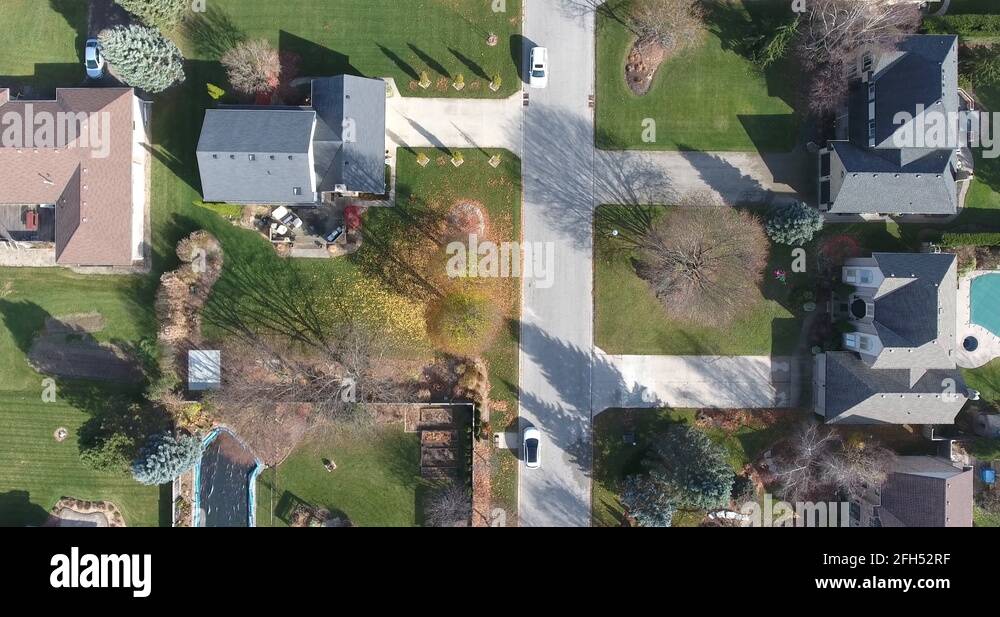 Sideways Pan Of Houses Aerial With Car Driving 4K Stock Video Footage ...