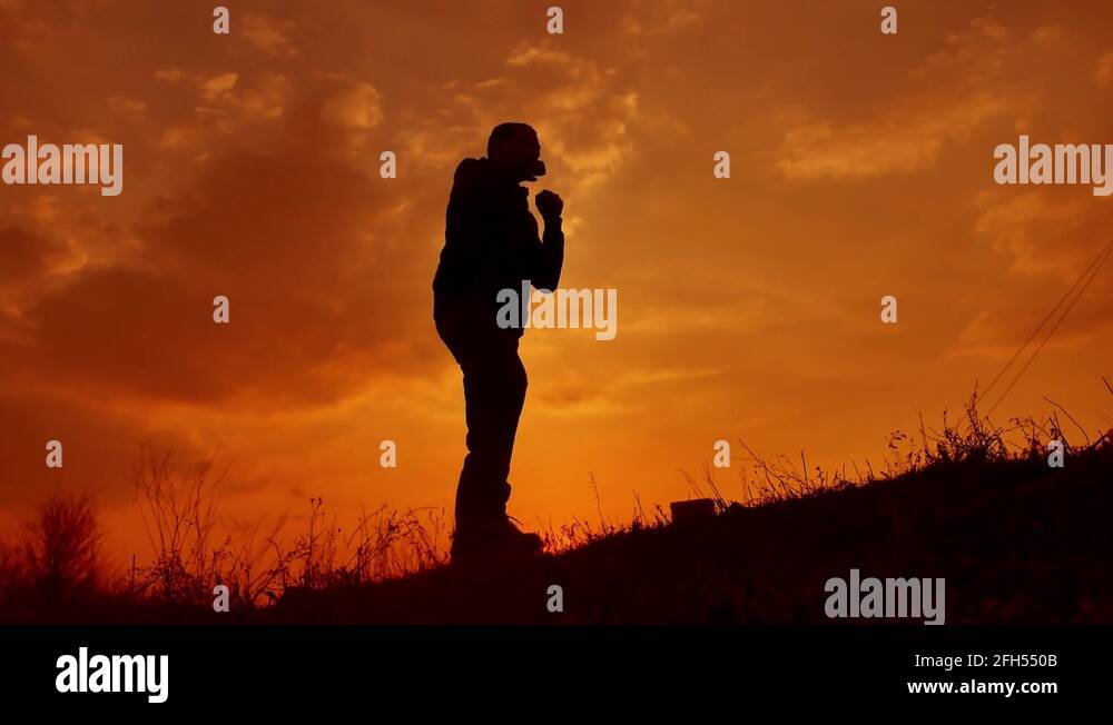 man boxer boxing on nature silhouette sunset sunlight. kickboxer the ...