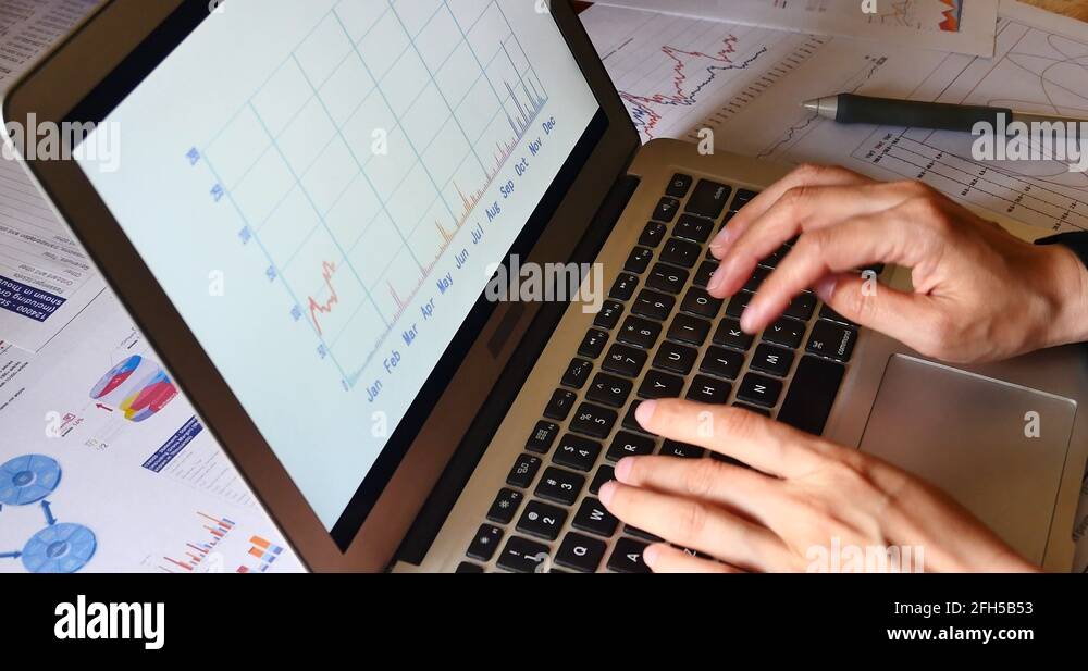 4k Businessman operating computer,change finance data trend chart on ...