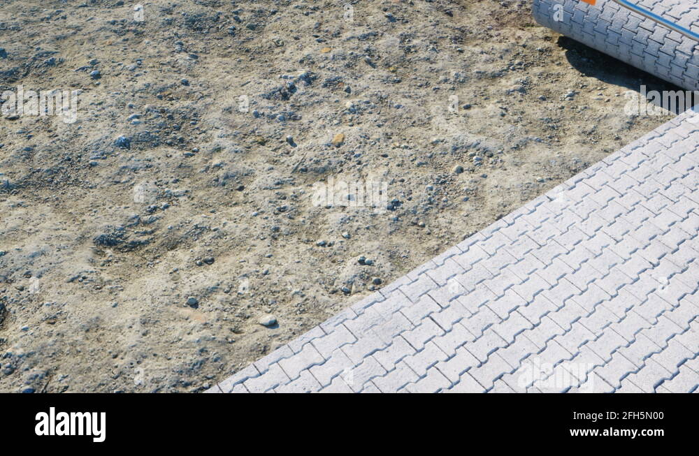 A roll of paving slab. Brush of paving slab. Building concept ...
