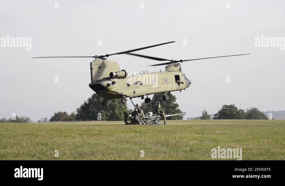 Boeing CH-47 Chinook lift M777A2 howitzers during sling load operation - 2016 Stock Video ...