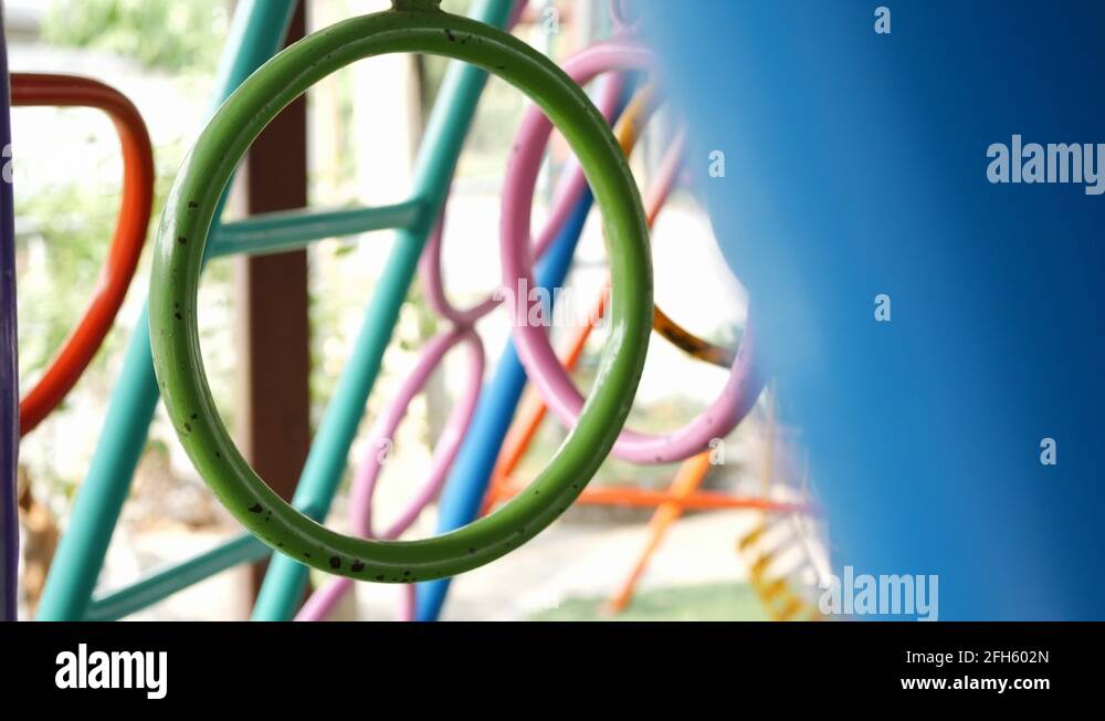 colorful steel loop hanging climb in playground for kids playing ...