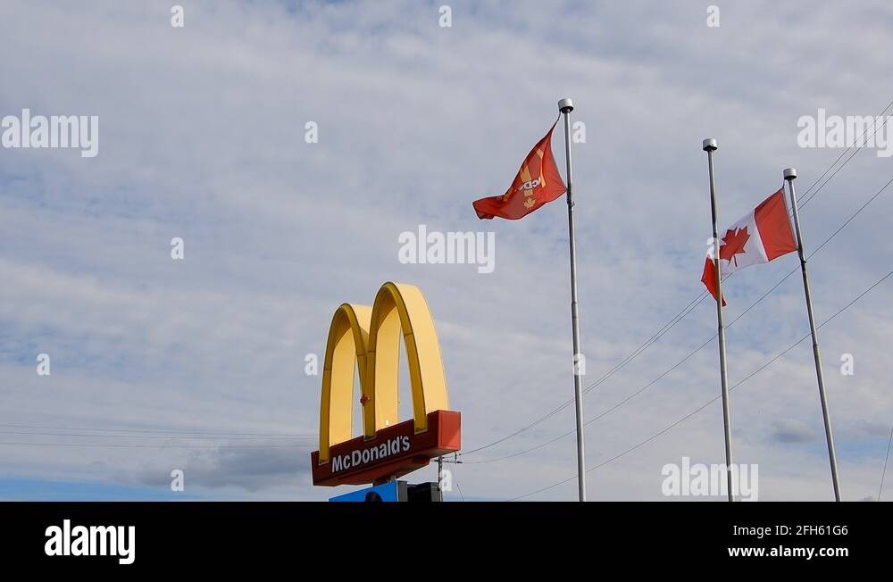 4K McDonald's Golden Arches With McDonald's Flag Stock Video Footage ...