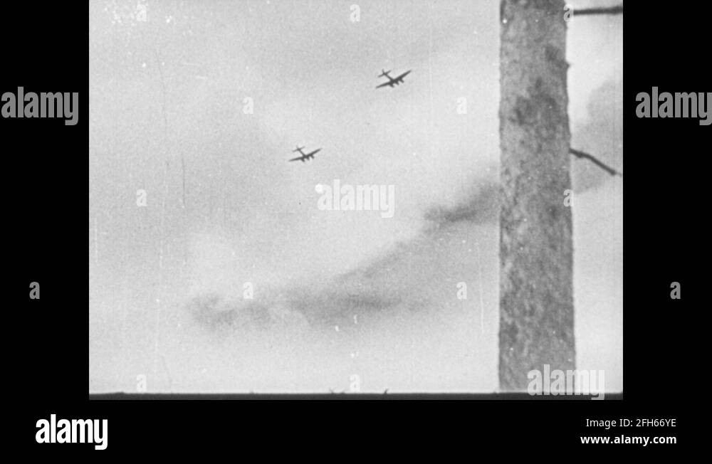 1940s: Bomber planes fly through sky. Shadow of plane races across ...