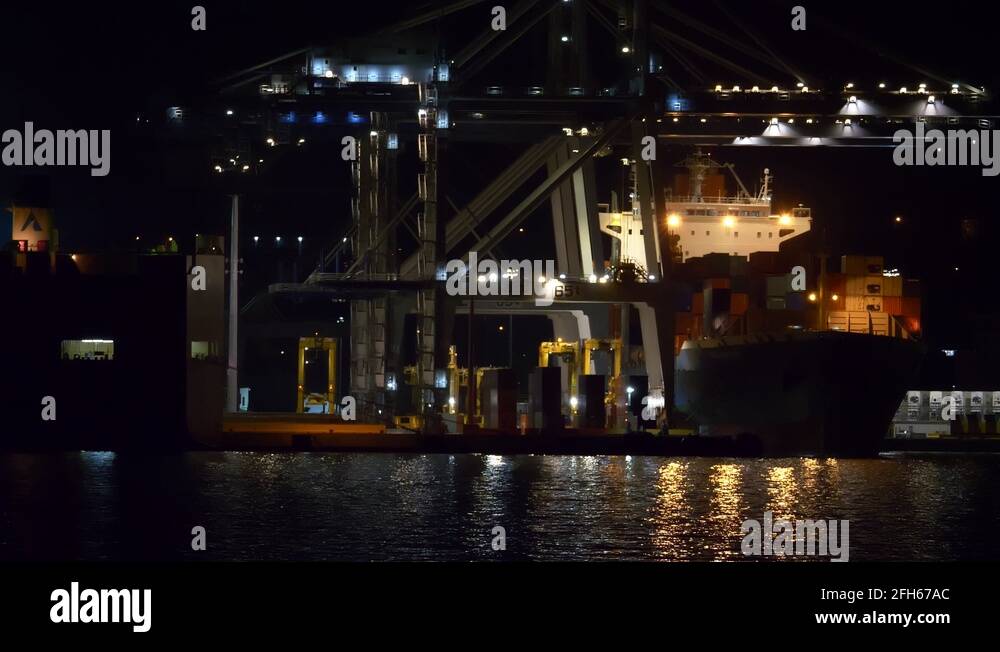 Container ship being loaded at Ports of Auckland's container terminal ...