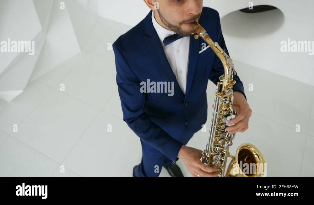 musician in suit and bow tie playing the saxophone. top view Stock ...