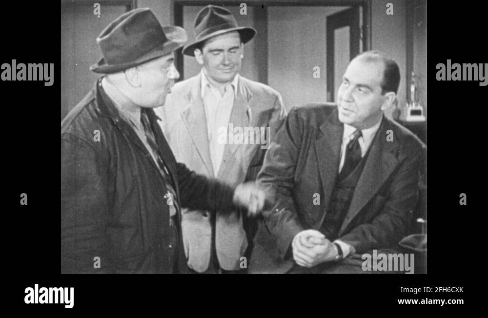 1960s: Men talk. Man enters building labeled "JOE LINK STEEL CO Stock ...