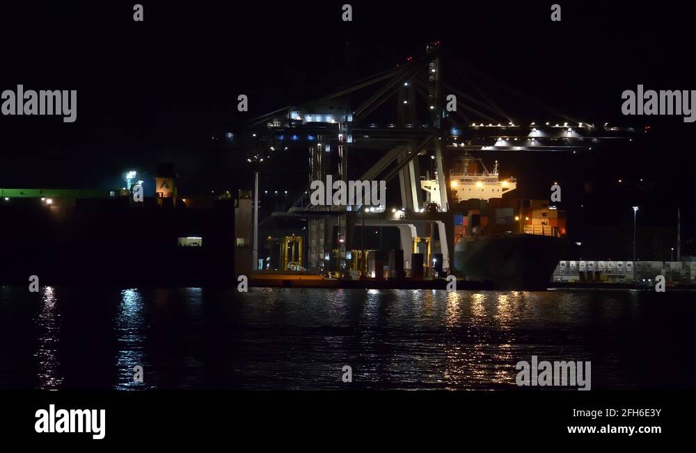 Container ship being loaded at Ports of Auckland's container terminal ...