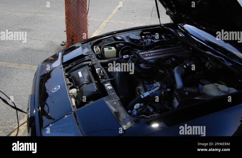 4K V8 Turbo Engine in Sports Car under Hood Pan Stock Video Footage - Alamy