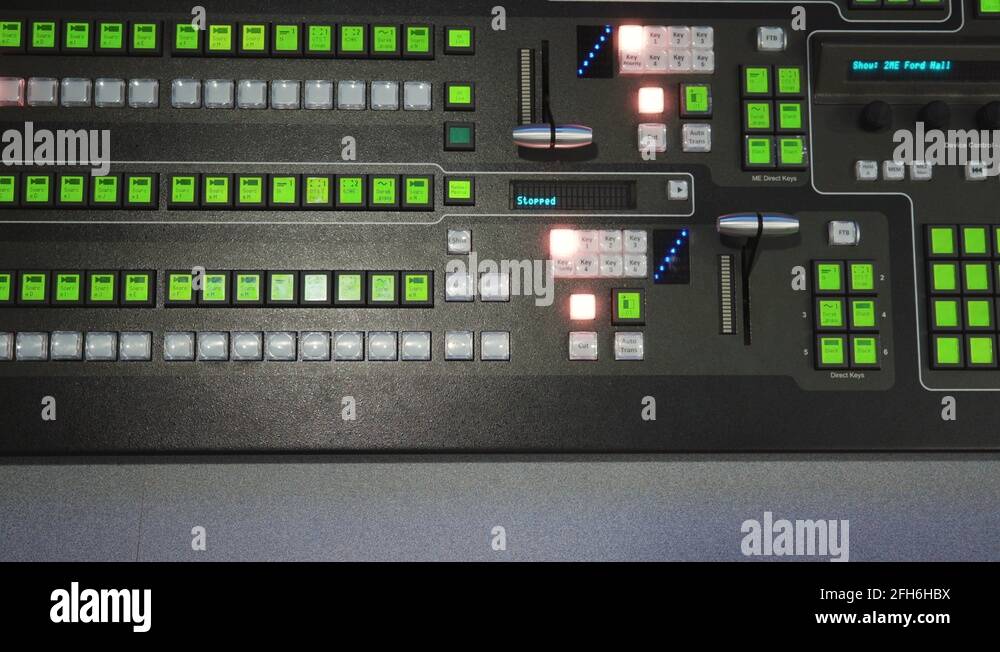 Adjusting a studio switching board cross-fade lever in a studio control ...