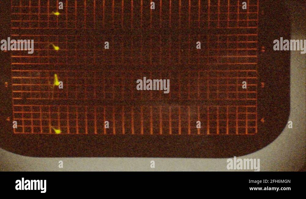 1960s: Close up, graphics on screen. Men seated at control panel, zoom ...