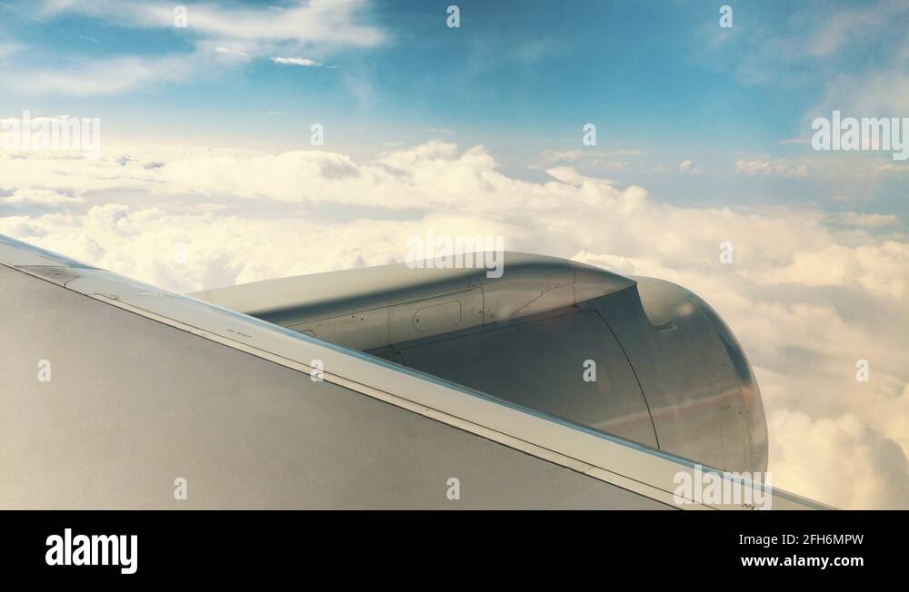 Left wing of engine and wing of flying plane Stock Video Footage - Alamy