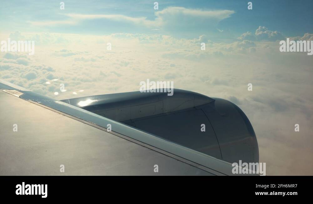 Left wing of engine and wing of flying plane Stock Video Footage - Alamy