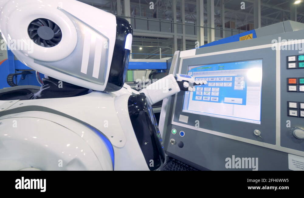 Factory robot is pushing buttons on an electronic touchscreen Stock ...
