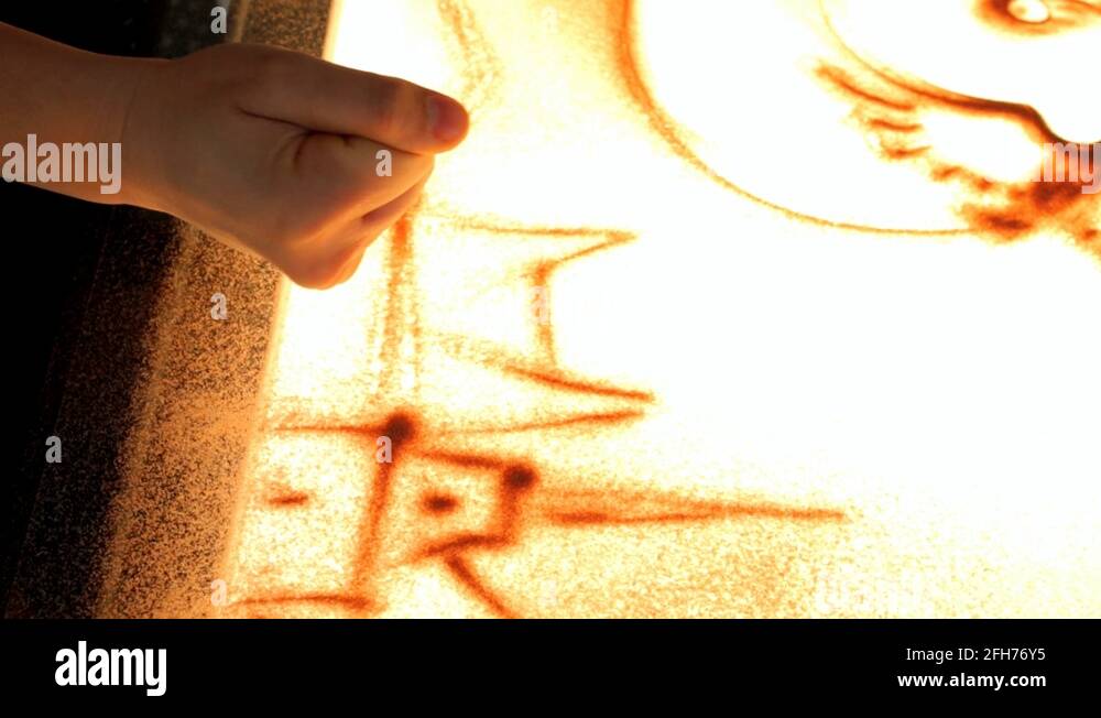 Drawing with sand. Drawing sand on a screen. Sand Artist. Hands draws ...