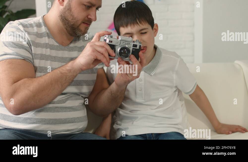 Dad shows his son how the camera works Stock Video Footage - Alamy