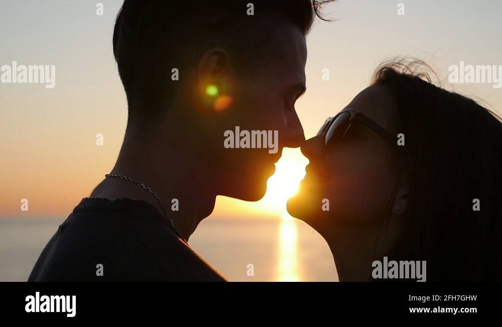 Eskimo kiss of a romantic girl and her happy boy at the Black Sea at ...