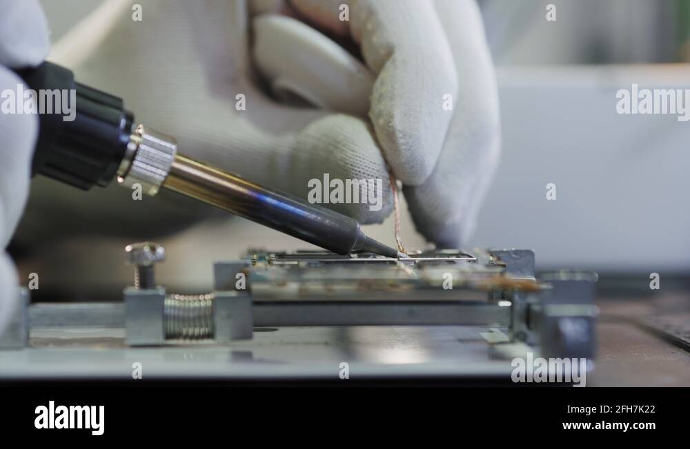 BGA chip soldering on the soldering station. Removal of temperature ...