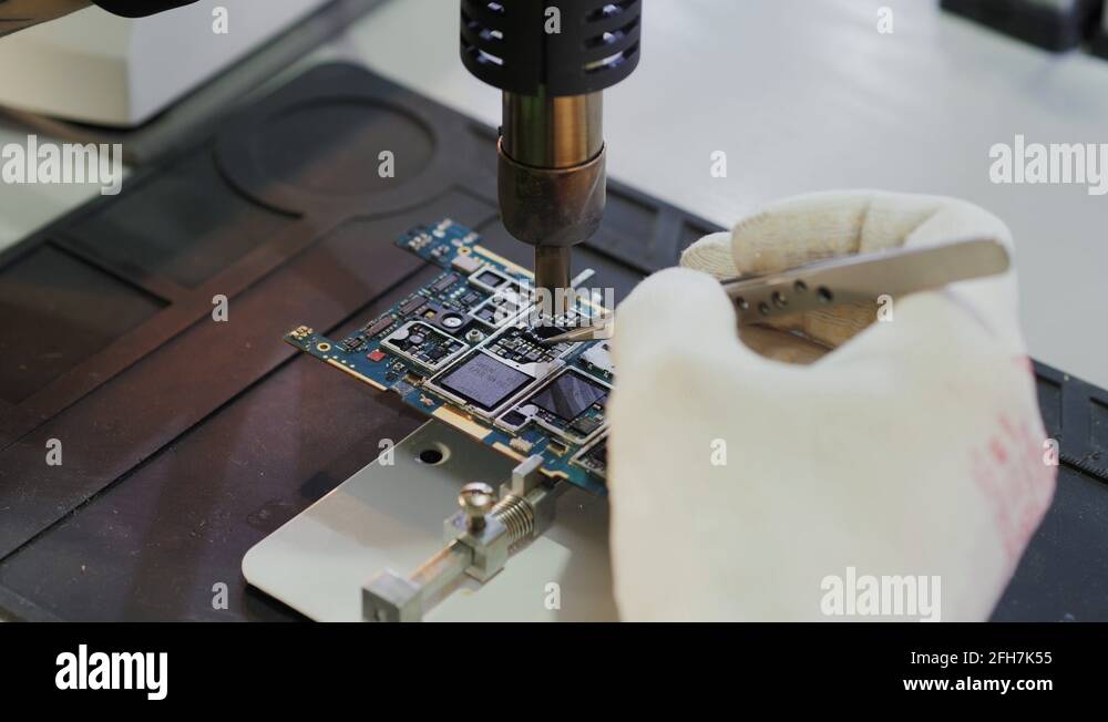 BGA chip soldering on the soldering station. Removal of temperature ...