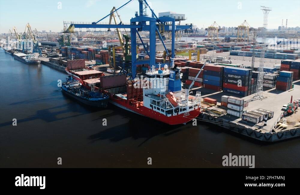 Loading on the cargo container ship on landing stage in Saint ...