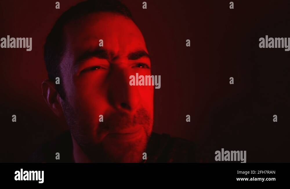 Man with angry facial expression screaming out loud and pointing his ...