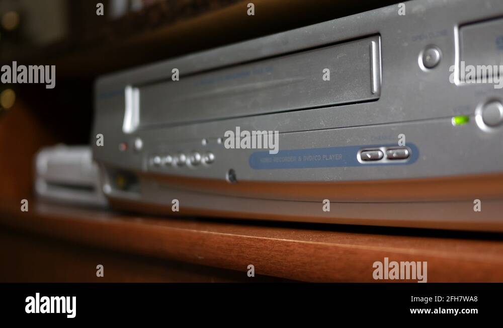 Inserting a VHS Tape into VHS player - normal style ALT VERSION Stock ...