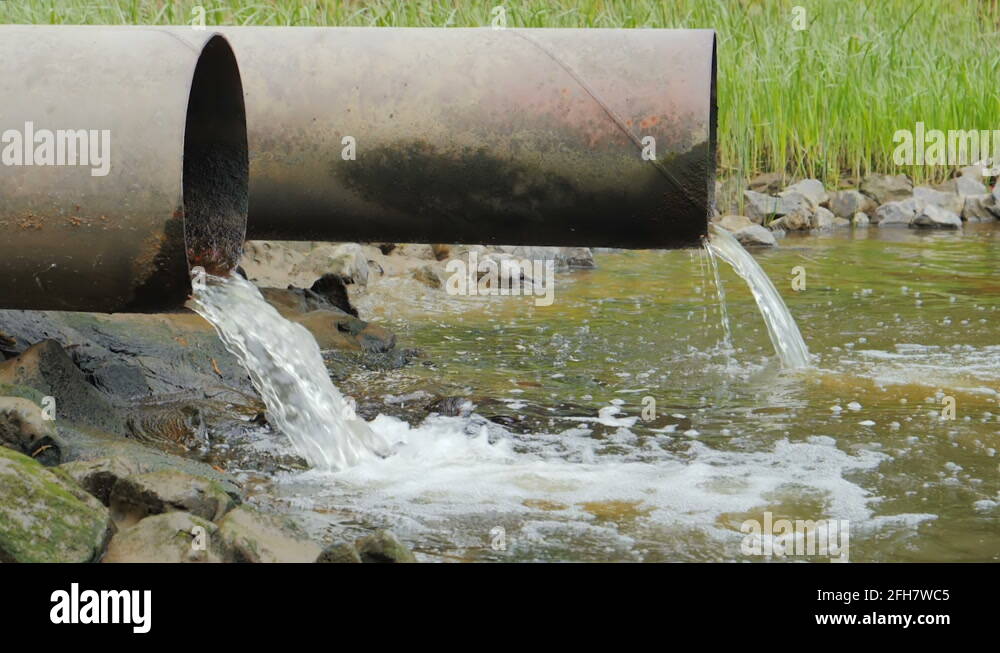 Water gushing out of drains through the cage fish into the canal ...