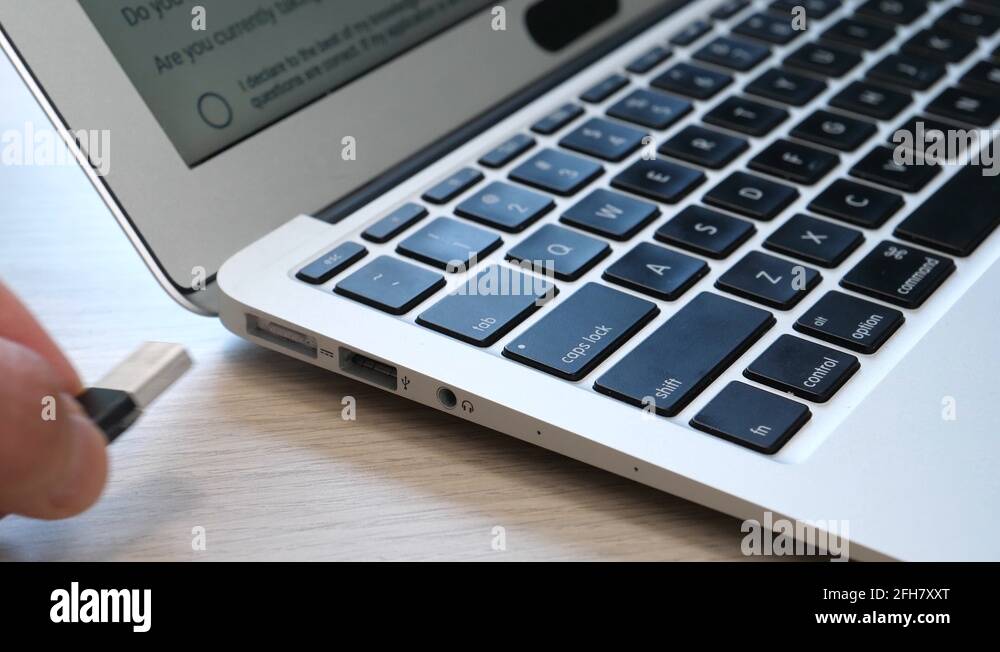 Plugging an USB Stick into a USB Port of a Laptop Computer Stock Video ...