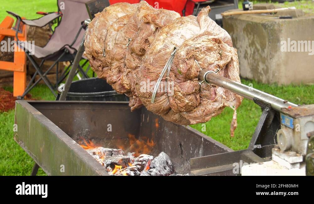 rotating meat on spit 4k Stock Video Footage - Alamy